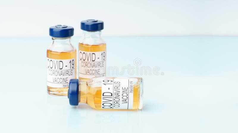 Three Vials of Covid-19 Vaccine on a Blue Table Stock Image - Image of ...