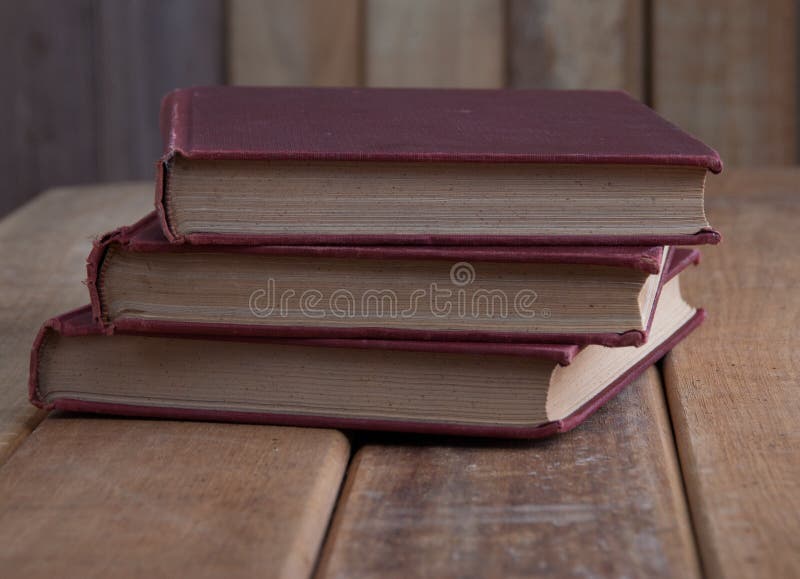 Three Vintage Books on Rustic Wooden Table Stock Photo - Image of data ...