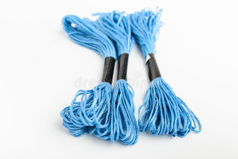 Three Vivid Blue Sewing Threads for Embroidery Isolated on a White ...