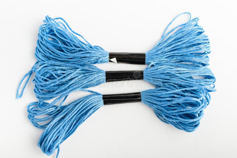 Three Vivid Blue Sewing Threads for Embroidery Isolated on a White ...