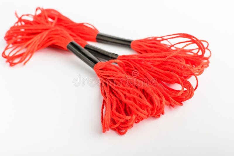 Three Vivid Red Sewing Threads for Embroidery Isolated on a White Table ...
