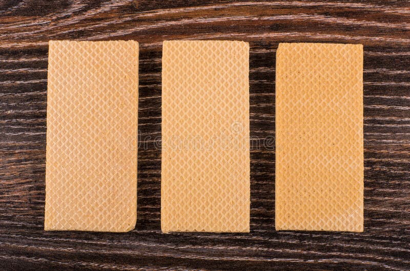Three Wafers on Dark Wooden Table Stock Image - Image of food, view ...