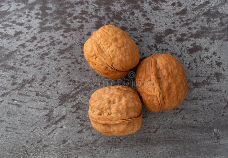 Three Walnuts on a Gray Background Stock Photo - Image of organic ...