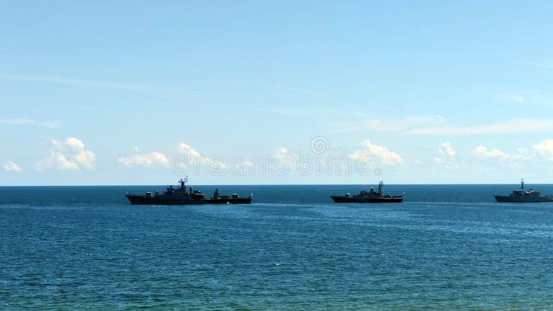 Three Warships at Sea Against a Clear Sea Horizon Stock Image - Image ...