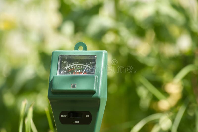 Three Way Meter PH, Light and Moisture in the Soil Stock Photo - Image ...