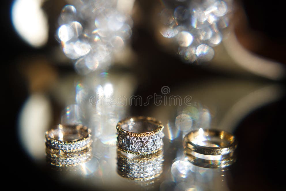 Three Wedding Rings on a Mirror Stock Image - Image of indoor, bridal ...