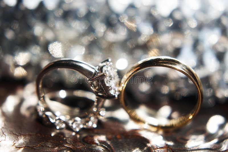 Three Wedding Rings on the Reflecting Surface with Highlights Stock ...