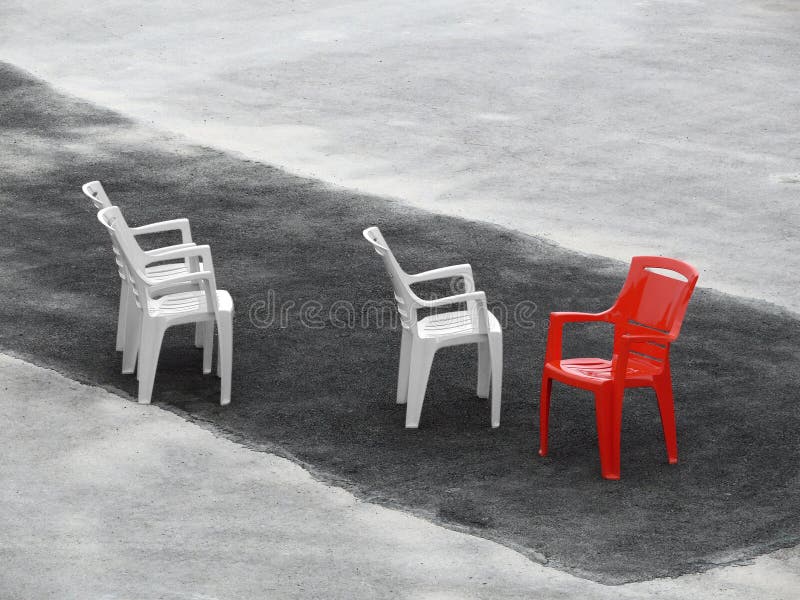 Three White Chairs and One Red on Dark Asphalt Stock Photo - Image of ...
