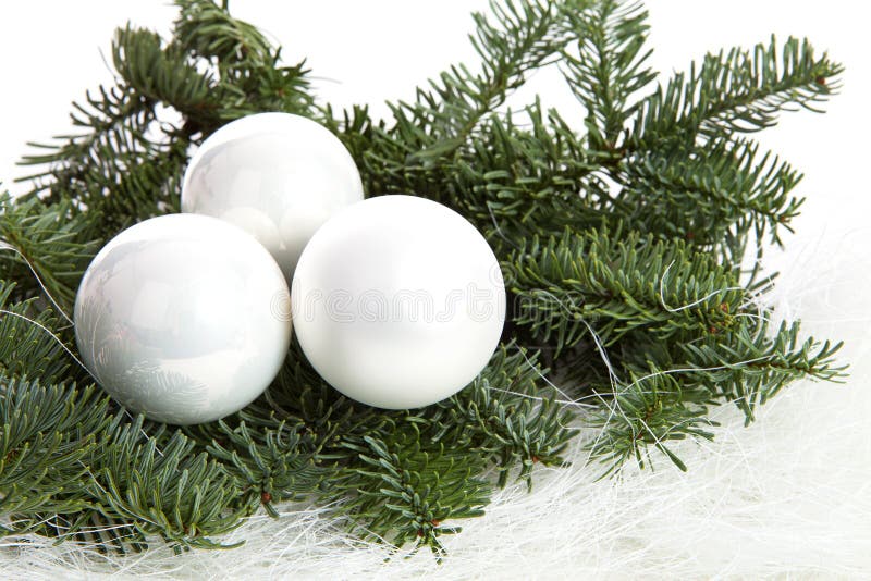 Three White Christmas Balls and Pine Tree Over White Background Stock ...