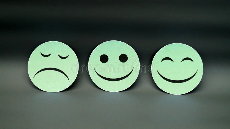 Three White Emotion Faces Displaying Sad, Neutral, and Happy ...