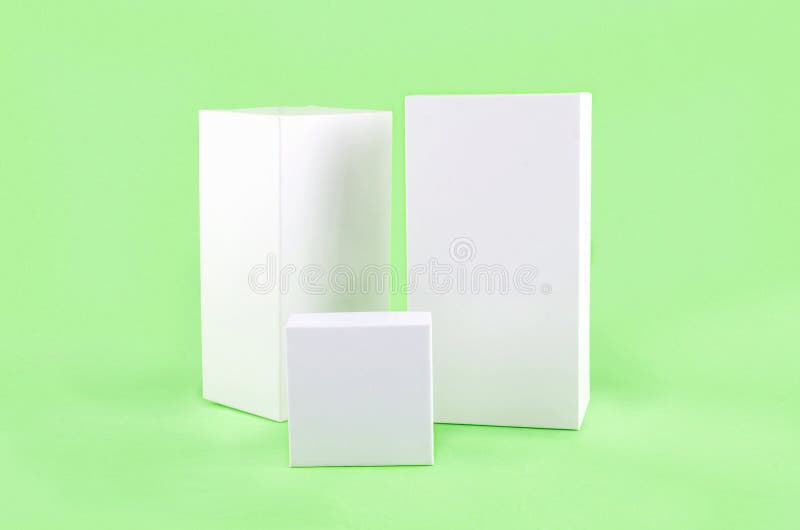 Three White Geometric Figure, a Rectangular with Shadows on a Light ...