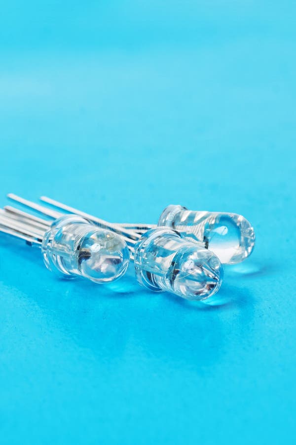 Three White LEDs Diodes on a Blue Background Stock Image - Image of ...