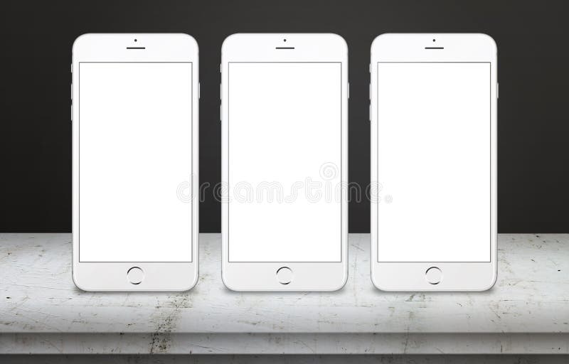 Three White Mobile Phones on Table with Blank, White, Isolated Display ...