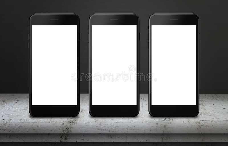 Three White Mobile Phones on Table with Blank, White, Isolated Display ...