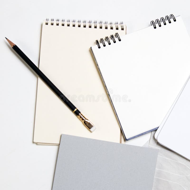 Three White Note Pad with Black Pencil on the Wooden White Table Stock ...