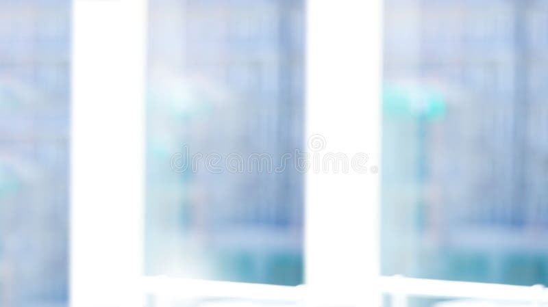 Three White Vertical Window Frames are Revealing Blurred High-rise ...