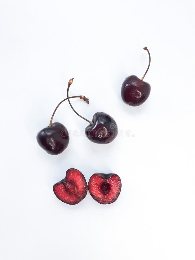 Cut and Whole Cherries on a White Background Stock Image - Image of ...