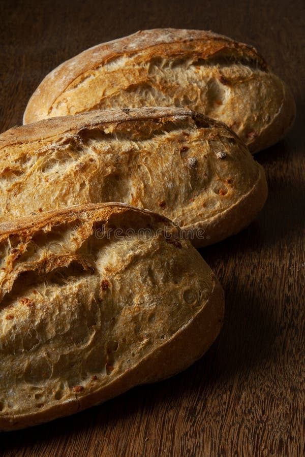 Three Whole Grain Bread on Wooden Table Stock Photo - Image of ...