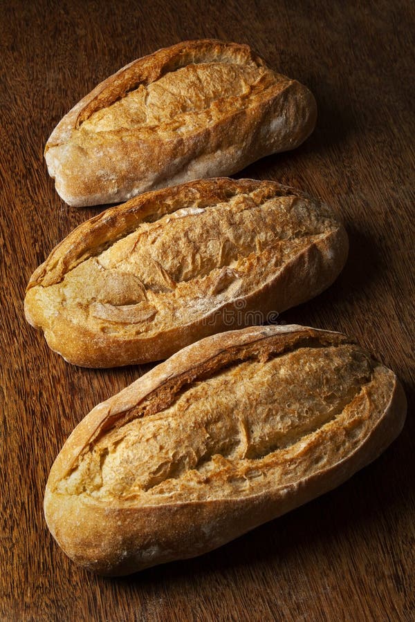Three Whole Grain Breads on Wooden Table. Stock Image - Image of bake ...