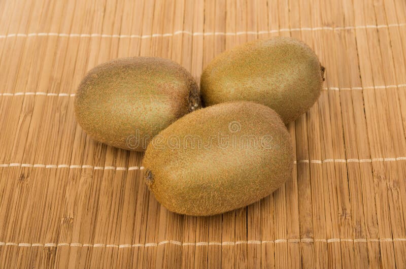 Three Whole Ripe Kiwi on Mat Stock Photo - Image of fruit, sweet: 86463486