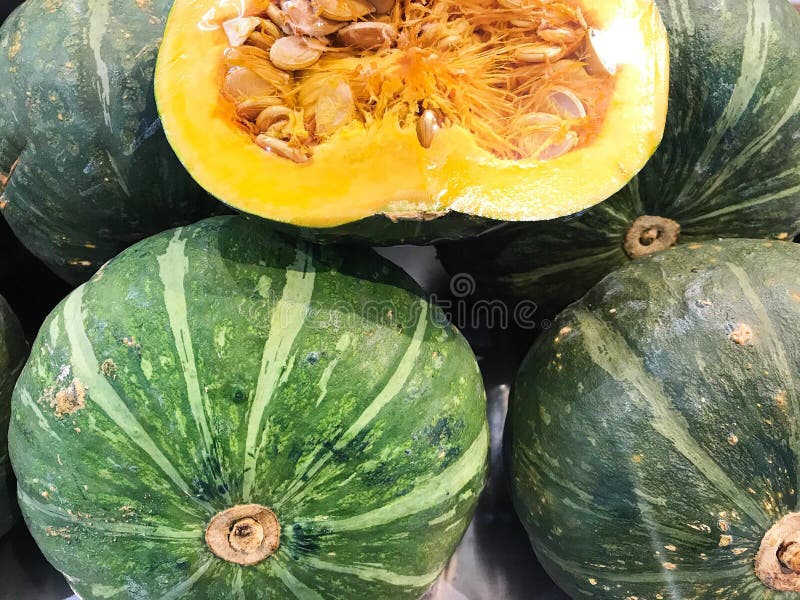 Three Whole Squashes with Their Characteristic Dark Green, Slightly ...