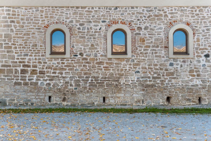 Three Window with Blue Sky Reflection on Old Castle Block Wall Stock ...