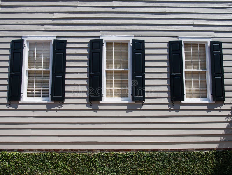 Three Windows with Black Shutters Stock Photo - Image of window ...