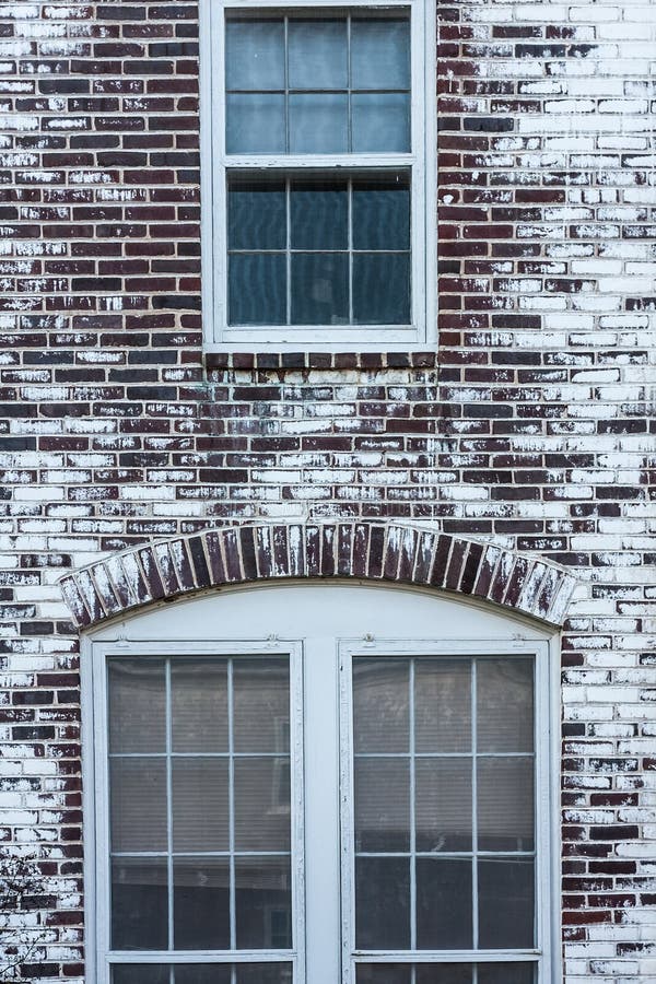 Section of Brick Wall with Two Windows Stock Photo - Image of daylight ...