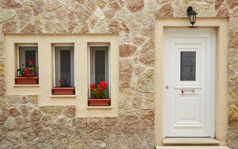 Three windows and a door stock photo. Image of house - 63350212