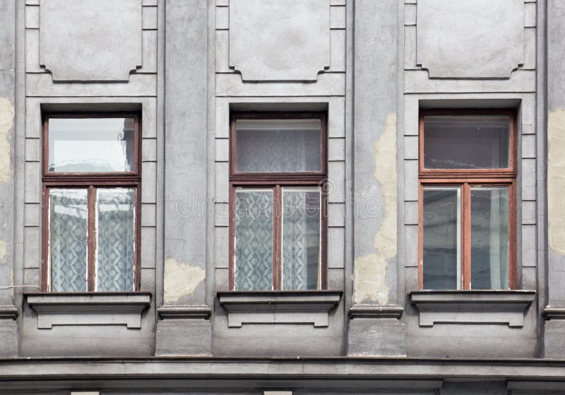 Three White Windows on the Beige Facade of the House Stock Photo ...