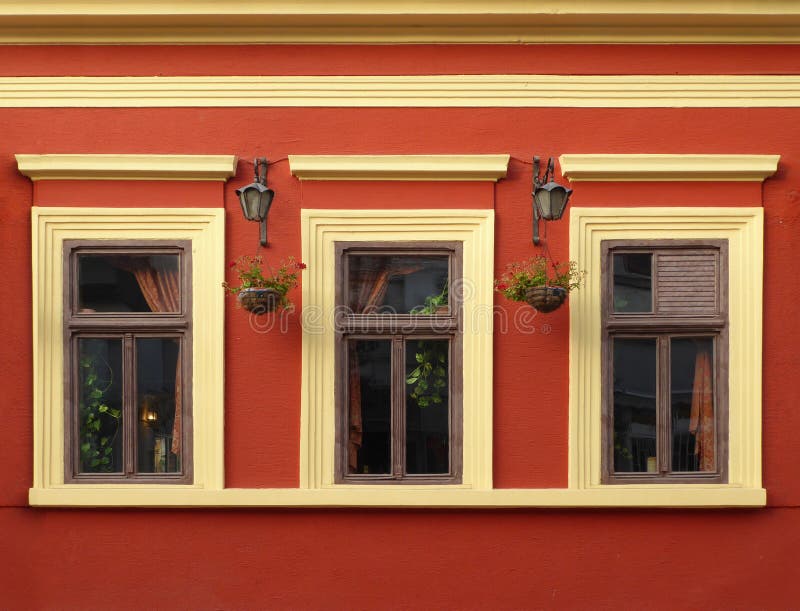 Three Windows on the Orange Red Wall Stock Image - Image of flowers ...