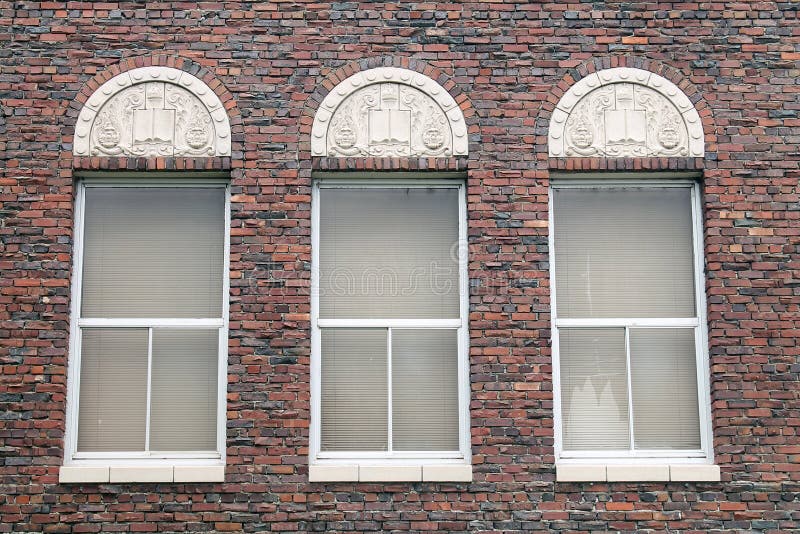 Three Windows in a Red Brick Building Stock Image - Image of windows ...