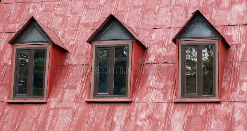 Three Windows on a Red Roof with a Brown Frame Stock Image - Image of ...