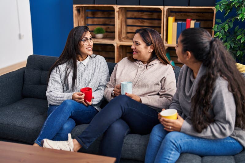 Three Woman Drinking Coffee Sitting on Sofa at Home Stock Photo - Image ...