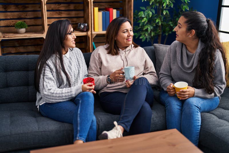 Three Woman Drinking Coffee Sitting on Sofa at Home Stock Photo - Image ...