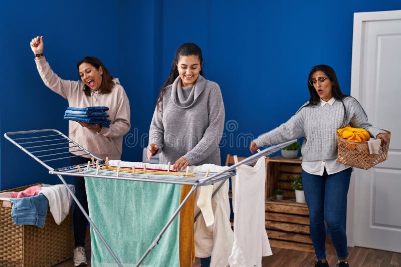 Three Woman Hanging Clothes on Clothesline and Dancing at Laundry Room ...