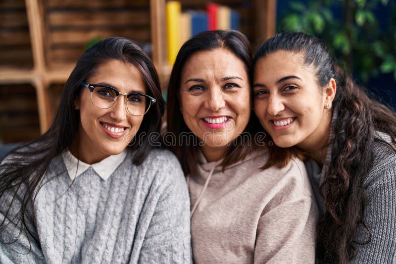 Three Woman Hugging Each Other Sitting on Sofa at Home Stock Photo ...