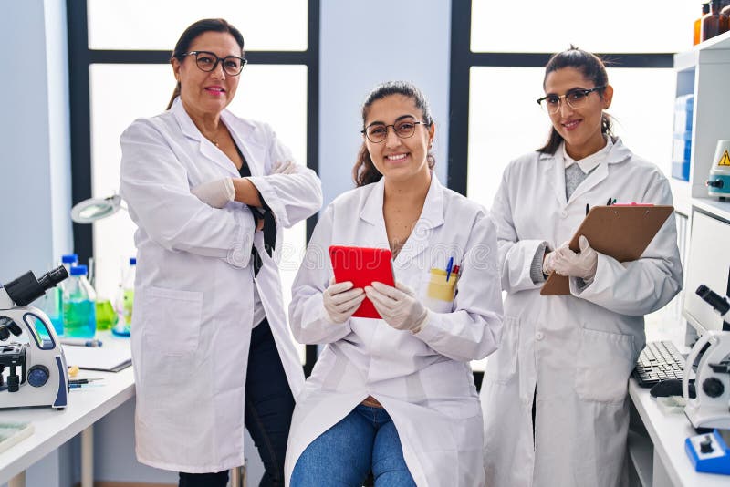 Three Woman Scientists Using Touchpad Write on Checklist at Laboratory ...