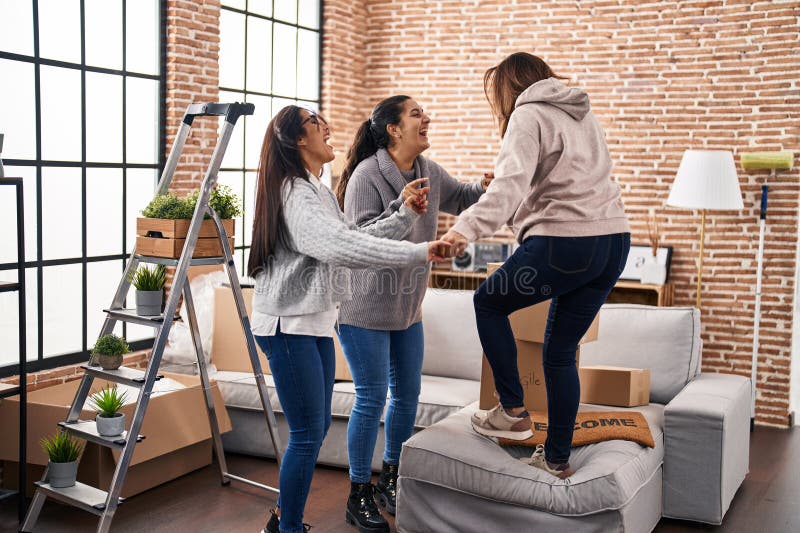 Three Woman Smiling Confident Dancing Together at New Home Stock Image ...