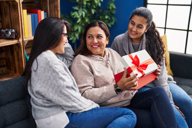 Three Woman Surprise with Gift Sitting on Sofa at Home Stock Image ...