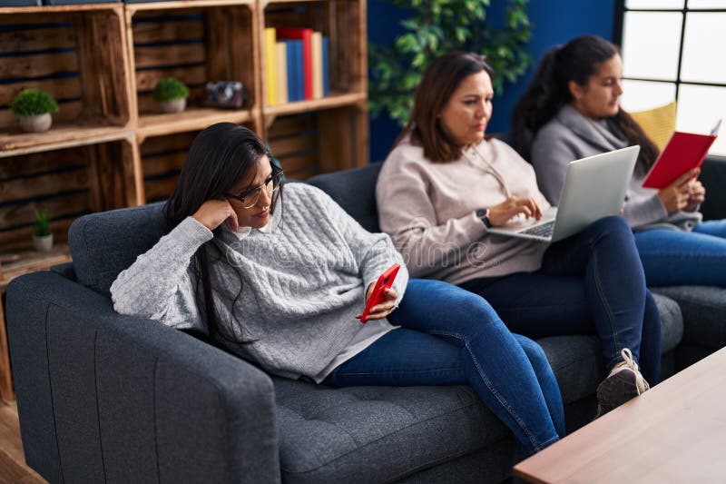 Three Woman Using Laptop and Smartphone Reading Book at Home Stock ...