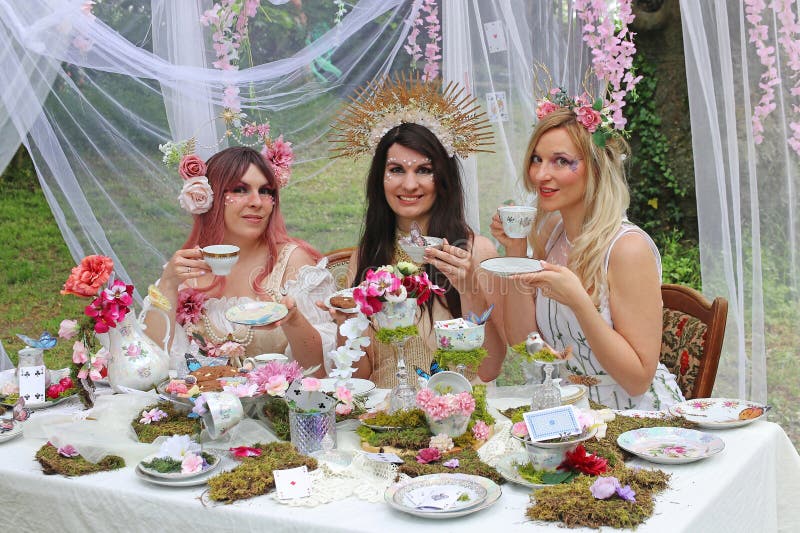 Three Women Dressed As Elves or Fairies Sit Happily at a Tea Table ...