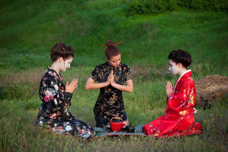 Three Women Drinking Tea in an Asian Manner Stock Photo - Image of ...