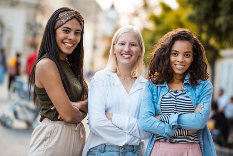 Two Women on Street Carrying Shopping Bags Happy Weekend Stock Image ...