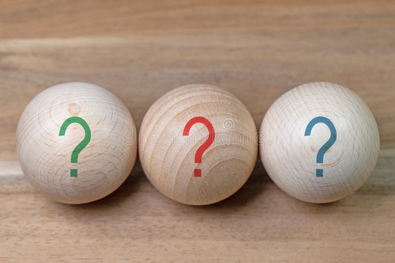 Three Wooden Balls with Printed Question Marks Stock Image - Image of ...