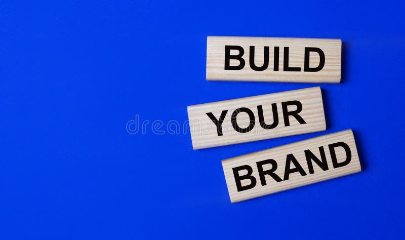 Three Wooden Blocks with the Text BUILD YOUR BRAND on a Bright Blue ... Three Wooden Blocks with the Text BUILD YOUR BRAND on a Bright Blue ...