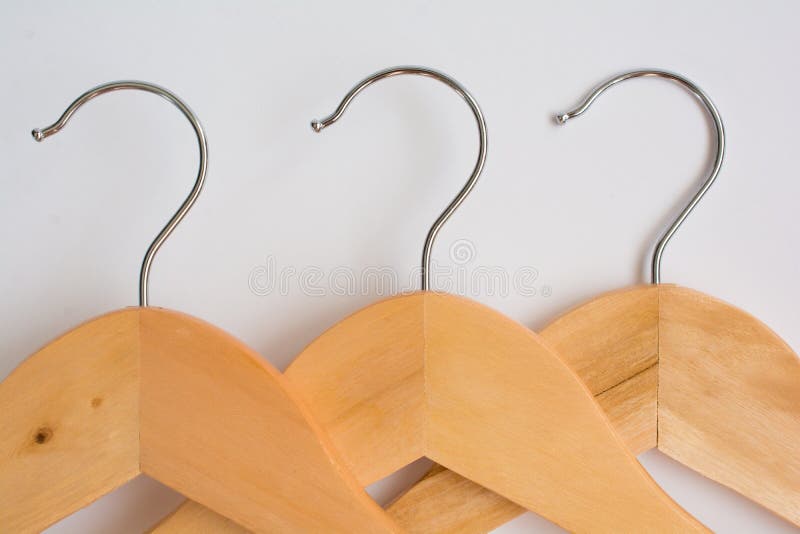 Three Wooden Coat Hangers stock photo. Image of isolated - 68283754