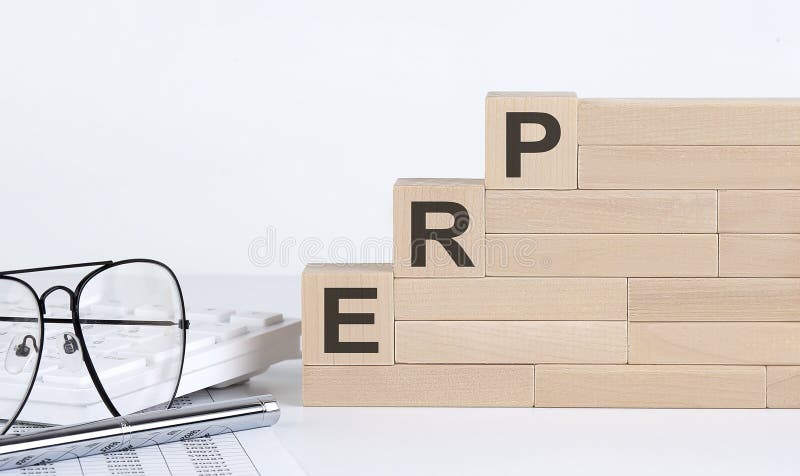 Three Wooden Cubes with Letters ERP on the White Table with Keyboard ...