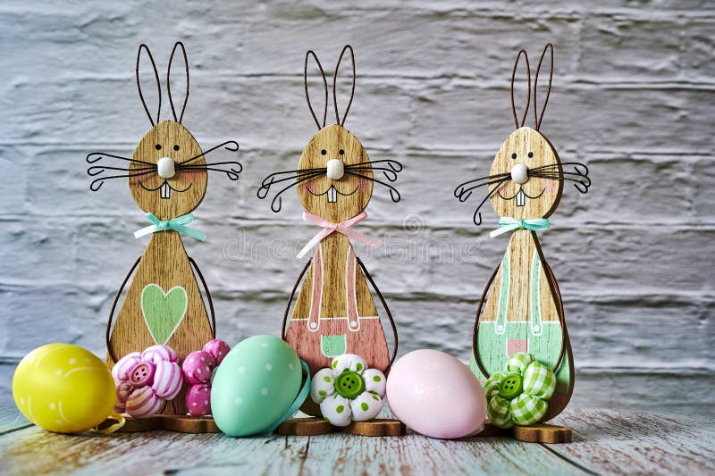 Three Wooden Easter Bunnies with Decoration Stock Image - Image of ...