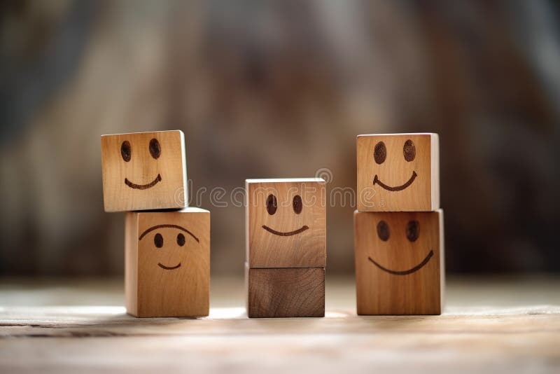 Three Wooden Figures with a Smiling Face, Concept of Artistic ...